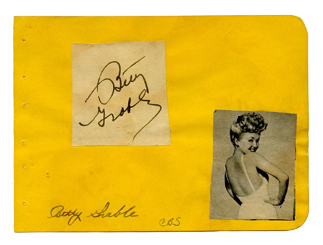 Film actors’ signatures on cards and album pages.