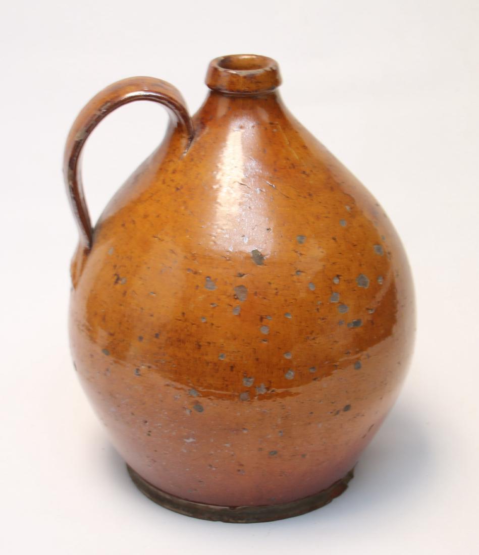 EARLY REDWARE JUG - Oct 07, 2017 | Hartzell's Auction Gallery, Inc. in Nj
