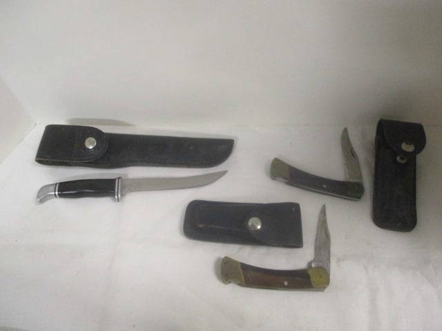 Two Buck Lock Blade Knives In Leather Sheaths And Fishing Filet Knife ...