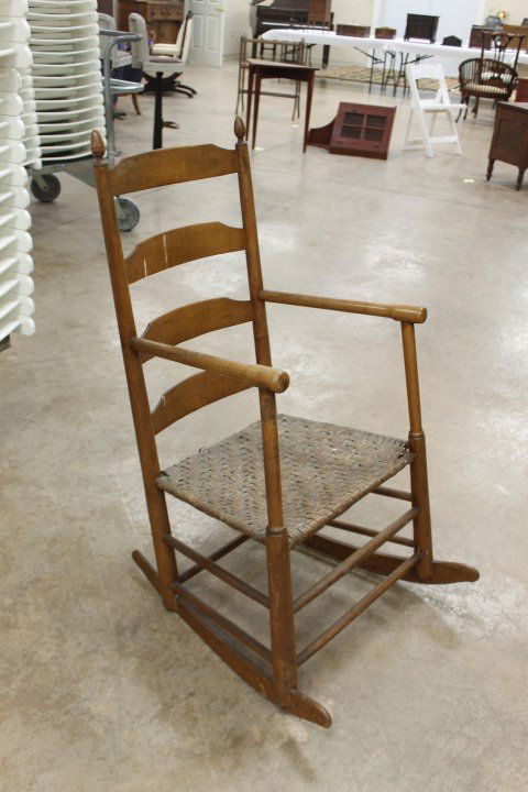 Shaker style rocker with woven seat.