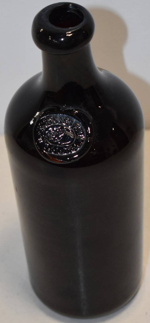 8 1/2" Deep Ruby Seal Bottle Auction