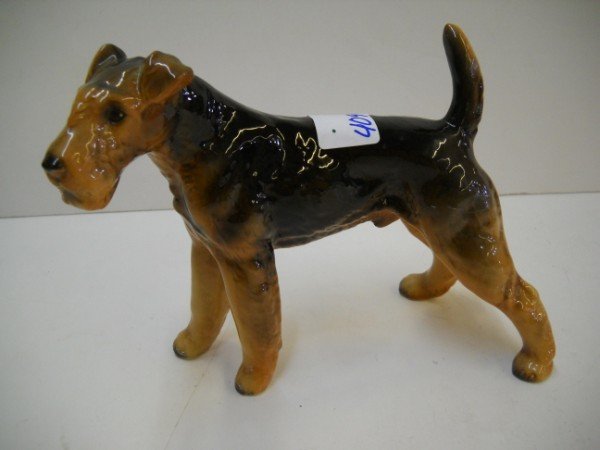 409: PORCELAIN DOG STATUE